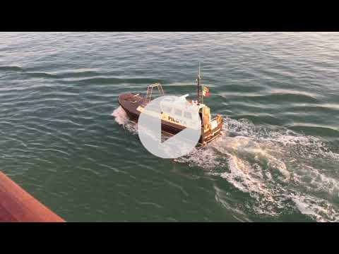 Venice pilot boat alongside 'Rhapsody of the Seas' sailing from Venice ...